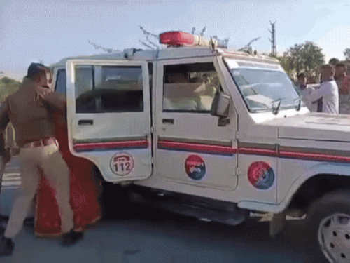 Woman narrowly escapes police jeep on busy highway