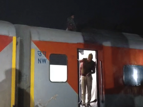 sabarmati express halted youth climbs roof moving train under high ...