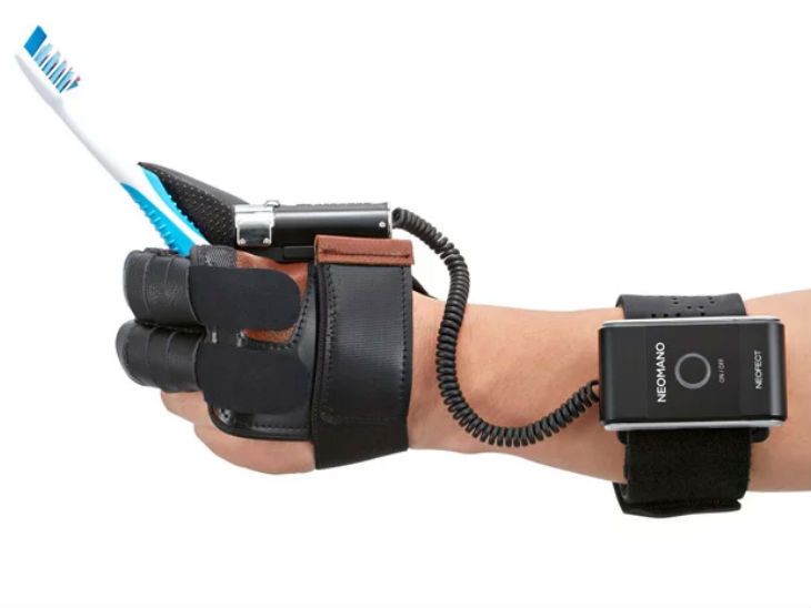 neomano robotic glove powers people with hand paralysis see video and ...