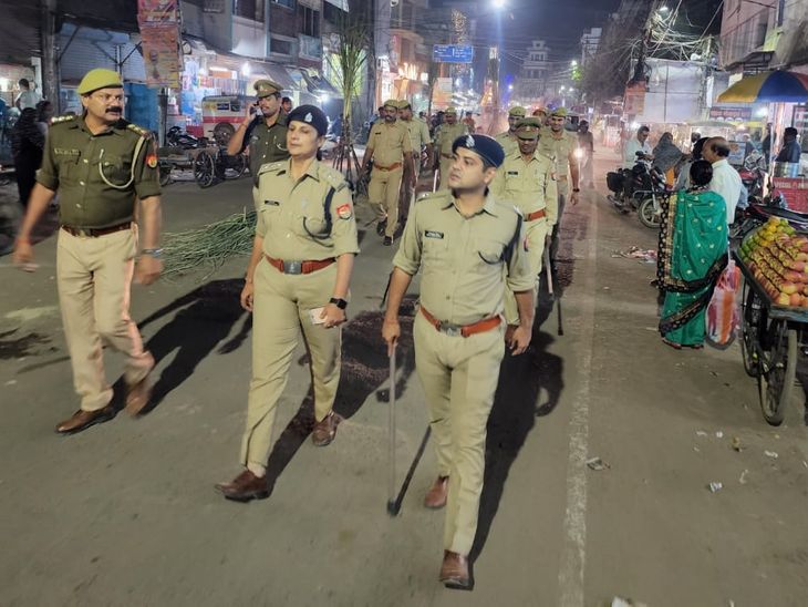 Police marched on foot at half a dozen intersections, questioned suspects