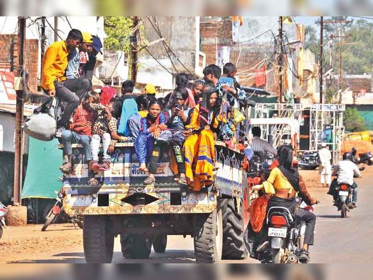 Tractor-trolleys and overloaded vehicles filled with people kept ...