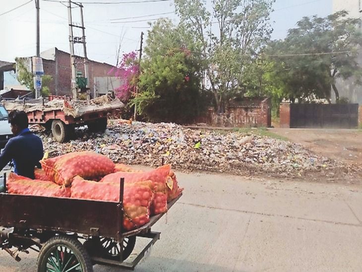There is a pile of garbage on National Highway 334B in Bahalgarh ...