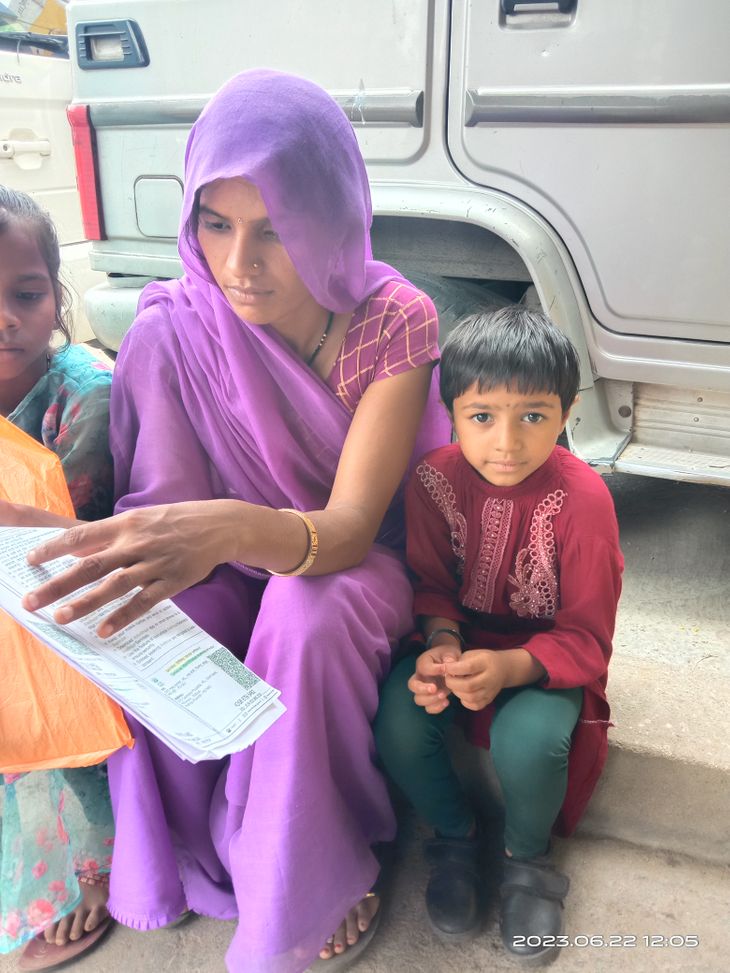 Mother with one daughter at the bank, father with the other in queue at the post office, Aadhaar ...