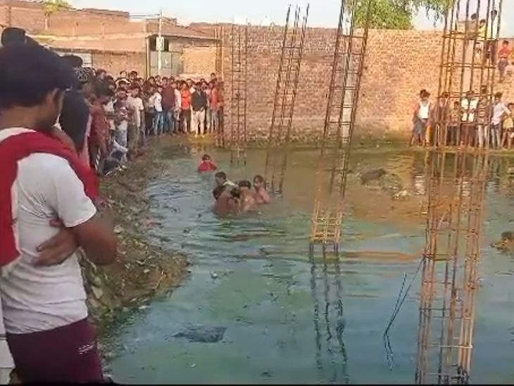 Rain water accumulated in the foundation dug for building construction ...