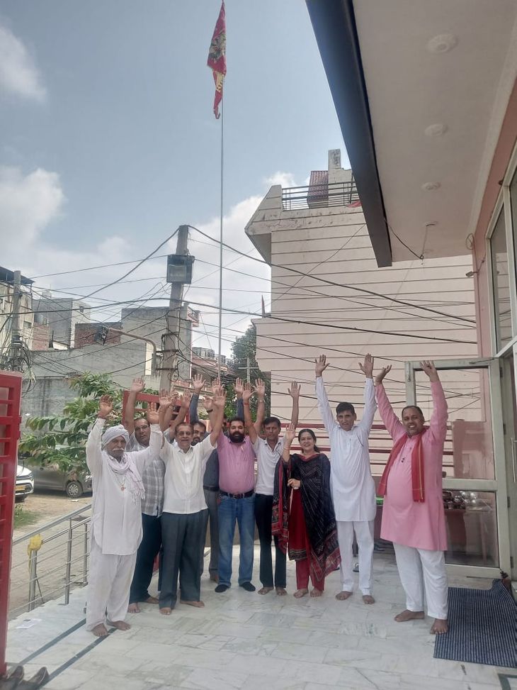 30 feet high red flag hoisted at the entrance of the temple | मंदिर के ...