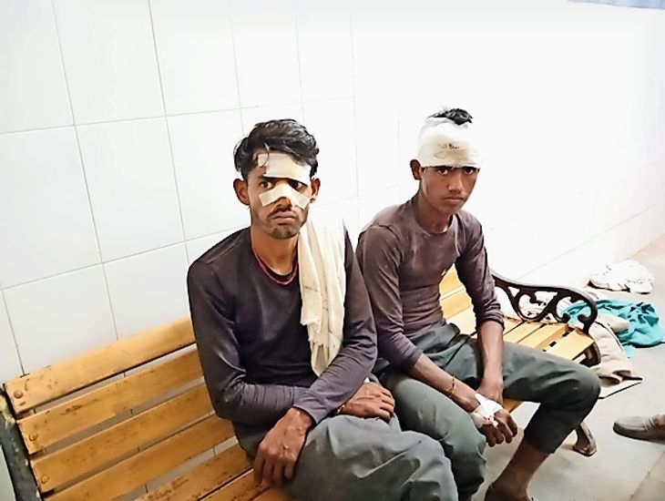 Fight over harvesting of crop with thresher machine, three including ...