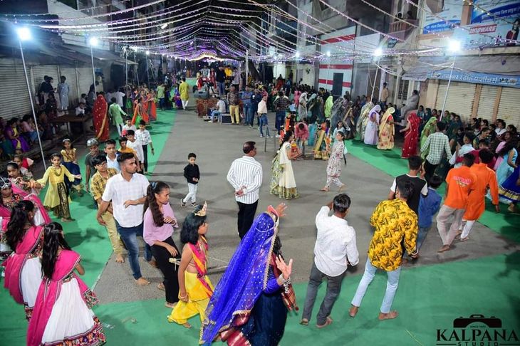 On Ashtami in Thandla, young boys and girls in colorful clothes ...