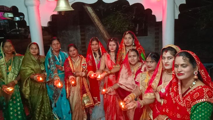 Praying for the long life of her husband by offering prayers, women ...