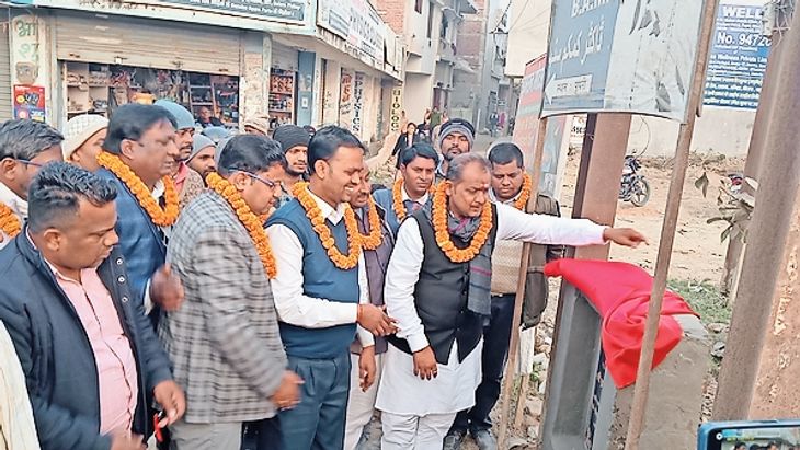 Laying the foundation stone for construction of PCC road and drain in ...