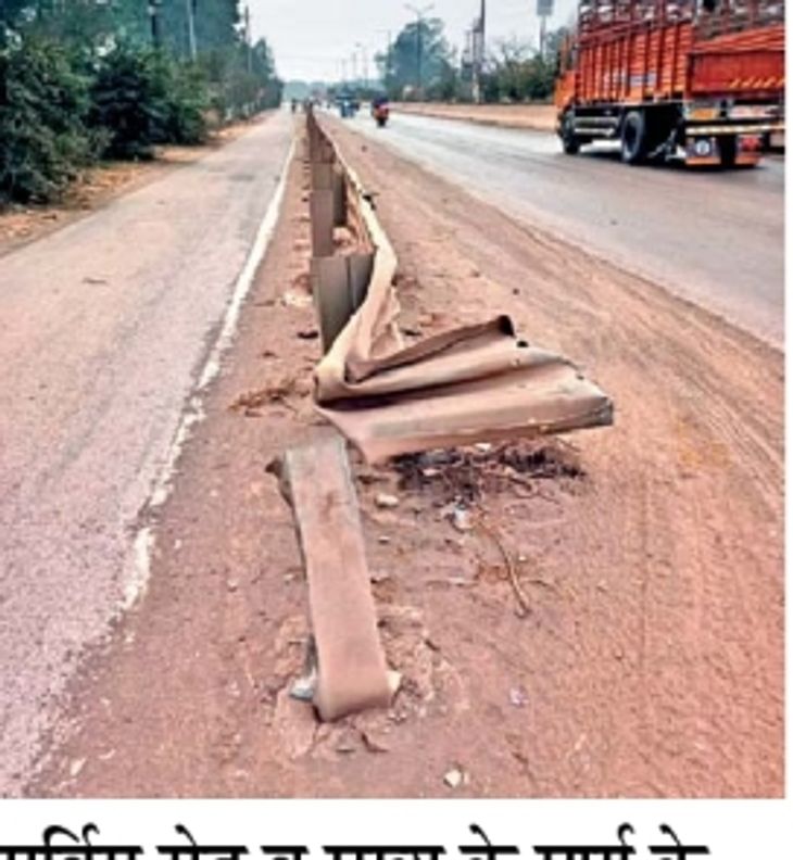 Railings between the highway and service road are broken, drains are ...