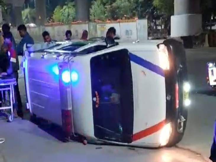 Ambulance carrying patient turns upside down
