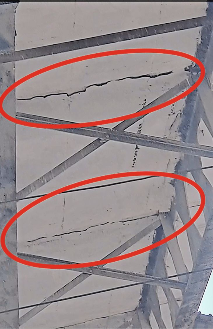The workers were worried about the cracks in the bridge at the station