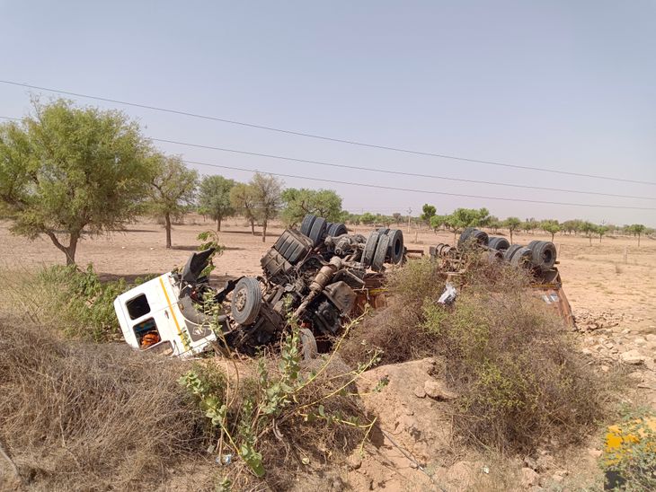 A trailer loaded with bricks went out of control and overturned near ...