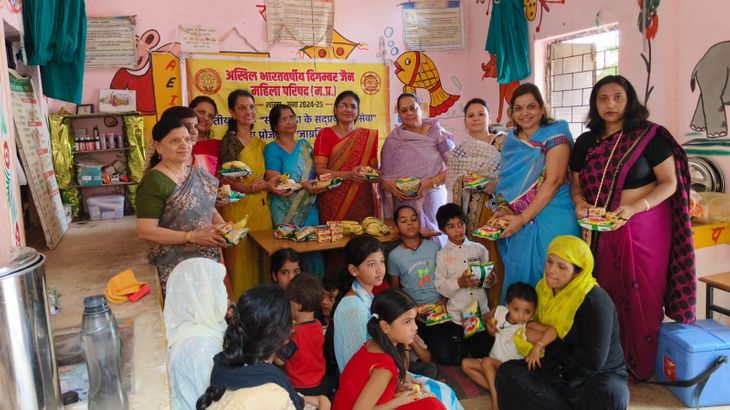Food items distributed to children by reaching Anganwadi center ...