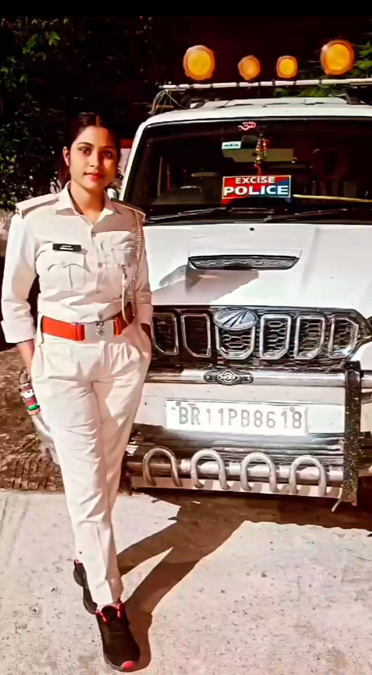 Video of woman constable singing a song in uniform next to a government ...