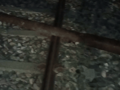 7 meter long pole placed on railway track
