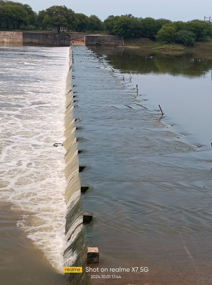 The gate got jammed, water is flowing over the anicut, there is a ...