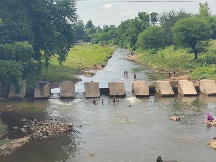 If the water flowing wastefully from the stop dam is saved, then 18 ...