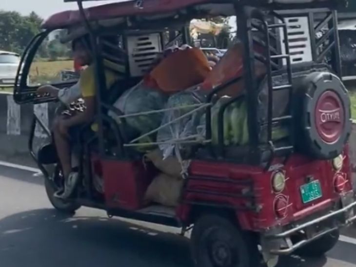 Luggage filled in place of passengers, passengers sitting on top of e ...