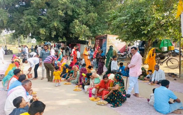 A huge crowd gathered at the Bagicha Mandir to receive Annakut Prasad ...