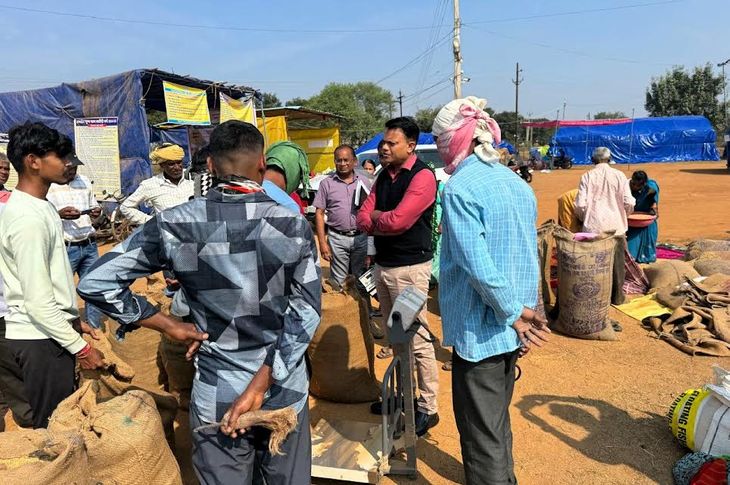 The collector weighed the paddy and checked its quality by checking its ...