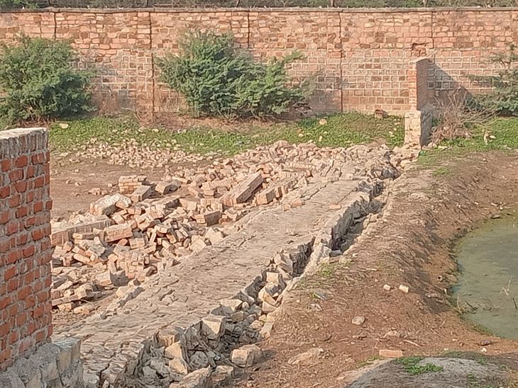 The boundary wall of the cemetery built at a cost of Rs 5 lakhs ...