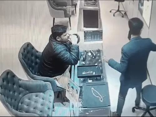 He engaged the salesman in conversation and stole the gold chain from ...