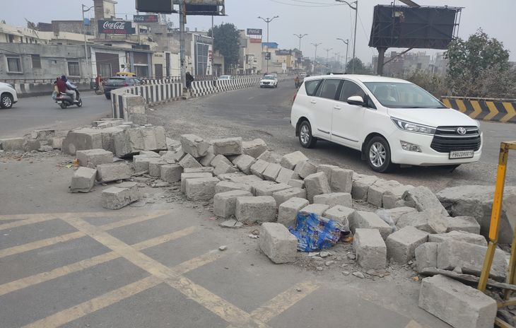 The scattered debris of the broken divider on Bhandari bridge is ...