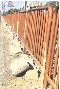 Railings are being installed on the dividers where pillars are to be ...