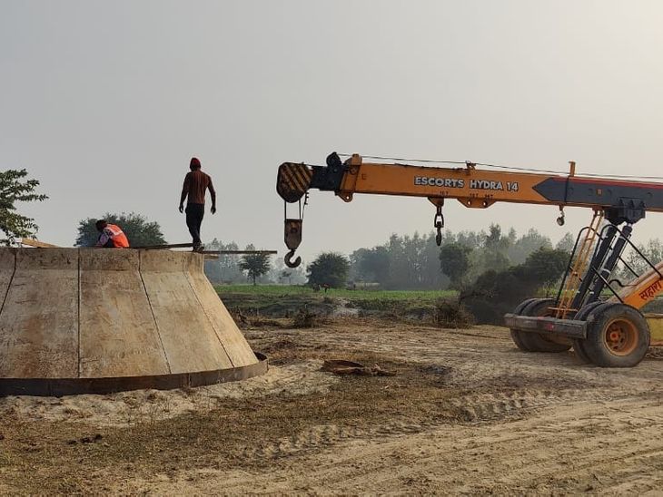Faces lit up with the construction of the bridge at Madhiya Ghat ...