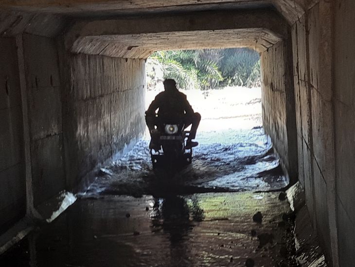 People took risks and came out from under the water filled culvert ...