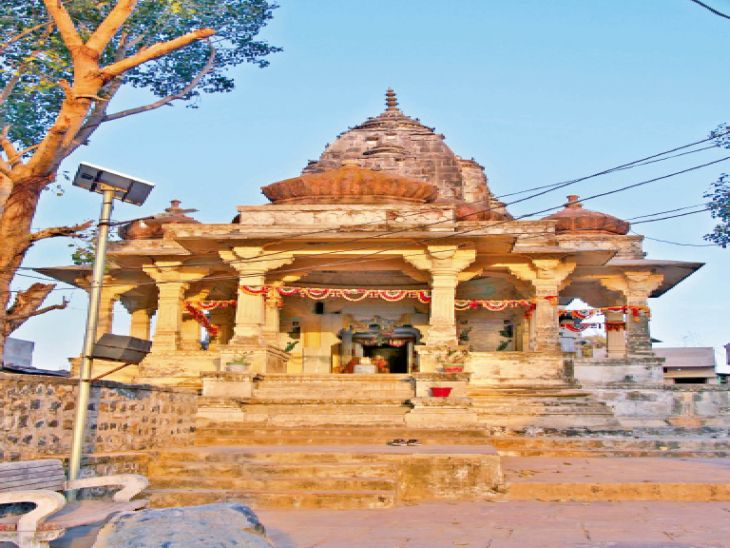 Eight feet high Shivling made from a single stone, on one side written ...