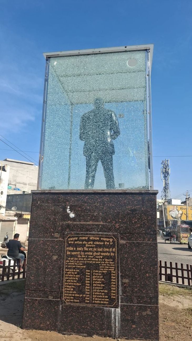 A mischievous person threw a stone at Baba Saheb's statue, the glass on the back side broke ...