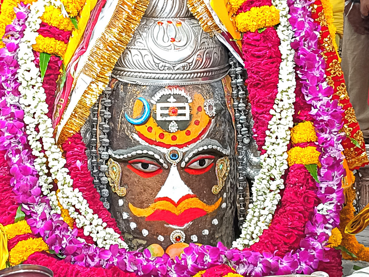 Lord Mahakal is adorned in the form of a king by offering Tripund ...