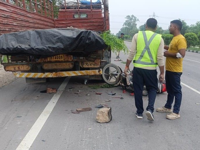 Bike rammed into DCM parked on the highway