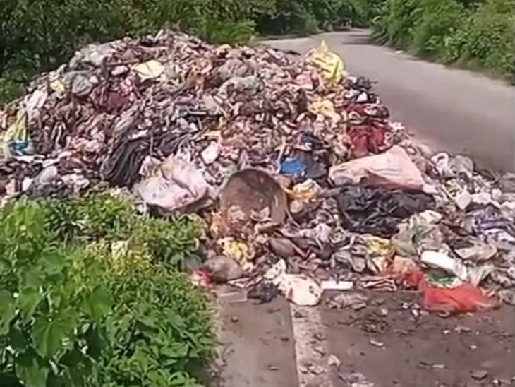 Pile of garbage on the service lane of NH-27 main road of 12 villages ...