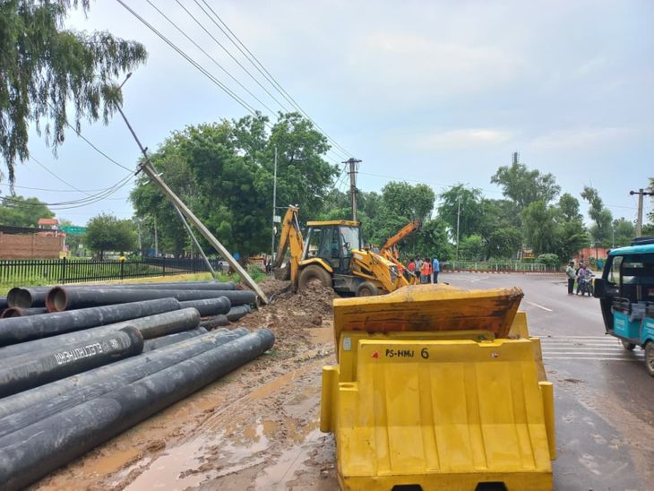 During sewerage work, the electricity pole at Tilak Circle got bent, a ...