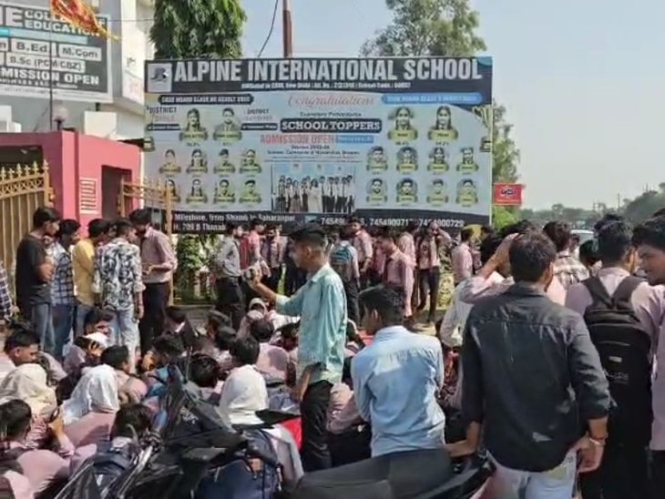 Students lock the gate of Alpine College