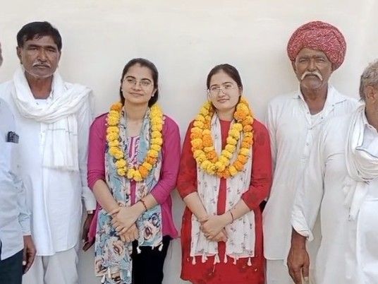 Two sisters excel in RAS exam