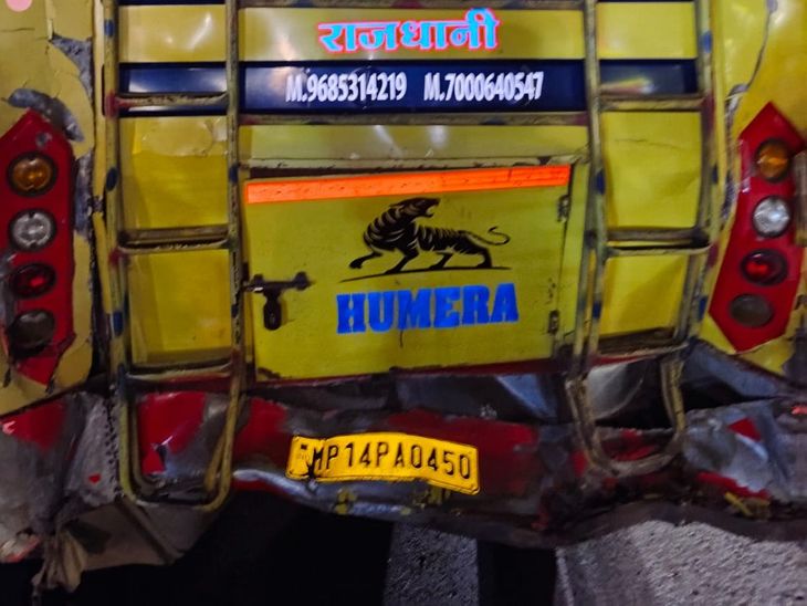 Container hits bike on four lane and rams into bus