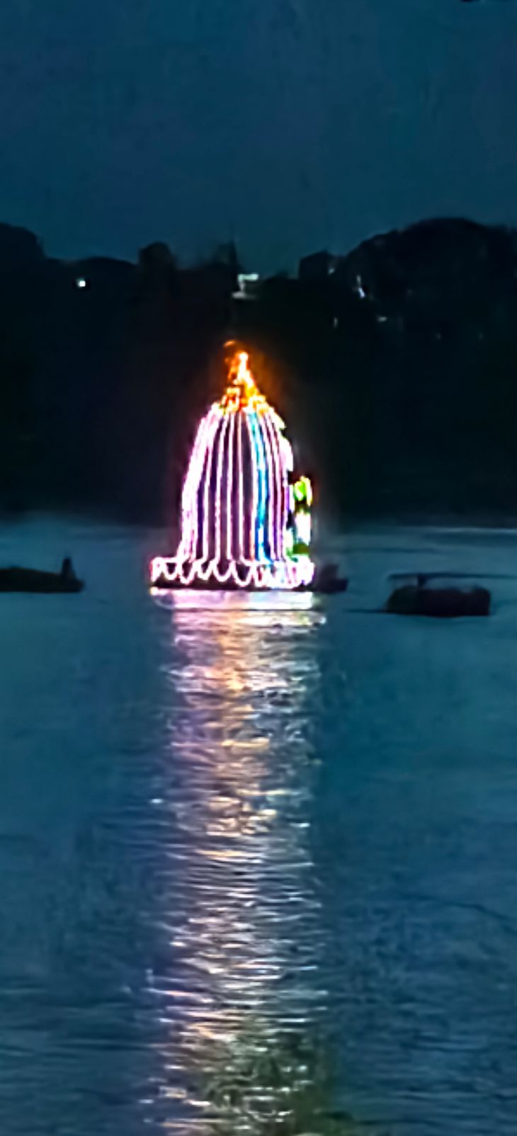 Baneshwar Shiva temple bathed in colorful lights in the middle of ...