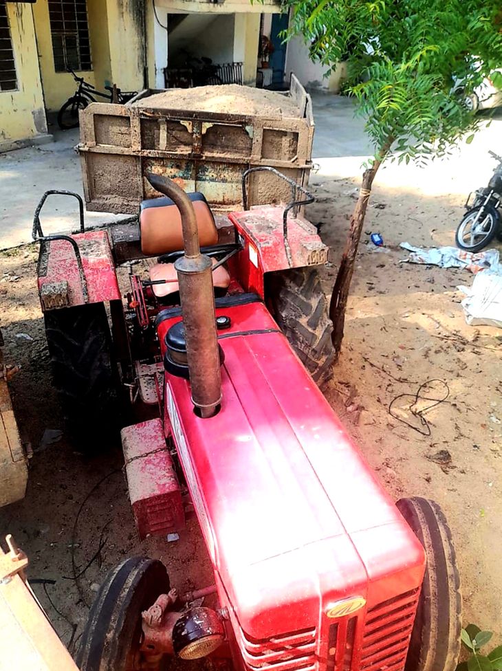 Seeing the patrol team, the driver left the tractor-trolley full of ...