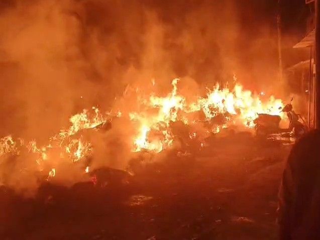 A moving tractor-trolley caught fire after touching an electric wire ...