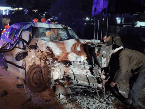 Car smashed into pieces after collision with truck, two killed