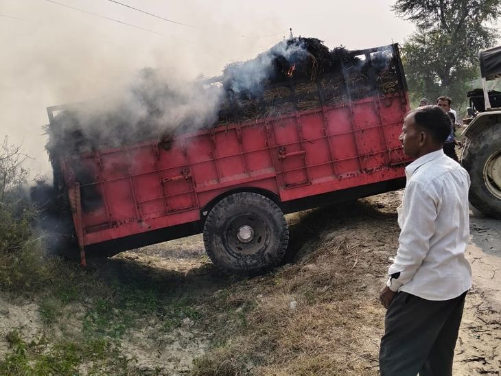 Tractor-trolley caught fire, farmer saved his life by jumping.