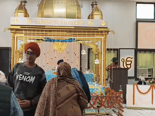 Satsang and Kirtan in the Gurdwara, chants of 'Wahe Guru' echoed ...