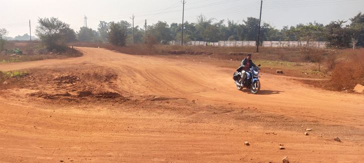 Dust and potholes on the 100-meter unpaved road connecting the Balod ...