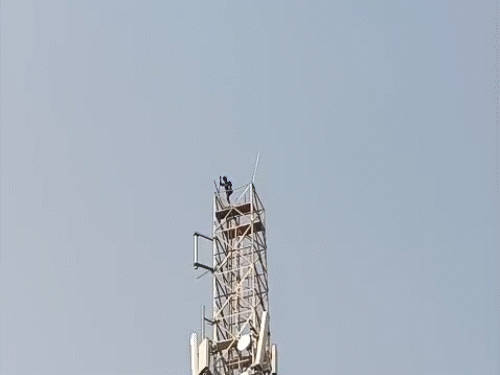 Husband's high-voltage drama on a 200 feet high tower...VIDEO