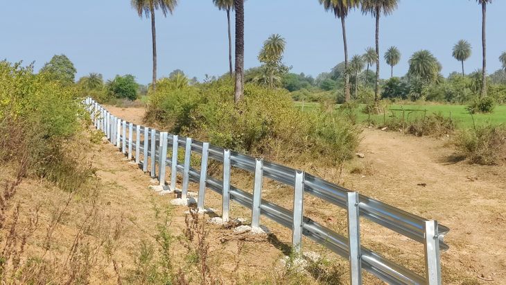 Railings are being installed on both sides of the railway track to ...