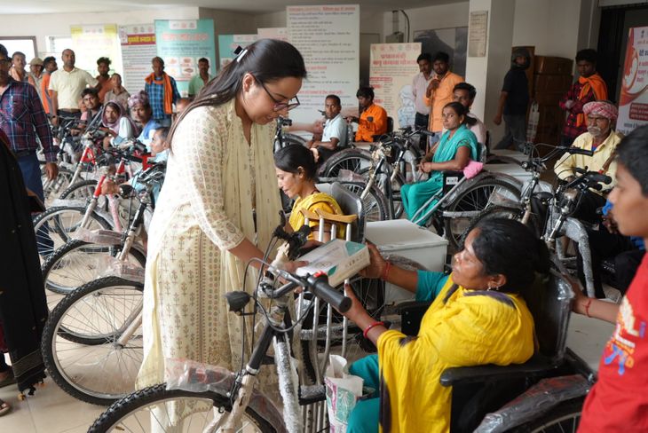Distribution of battery operated tricycles among 24 disabled beneficiaries.